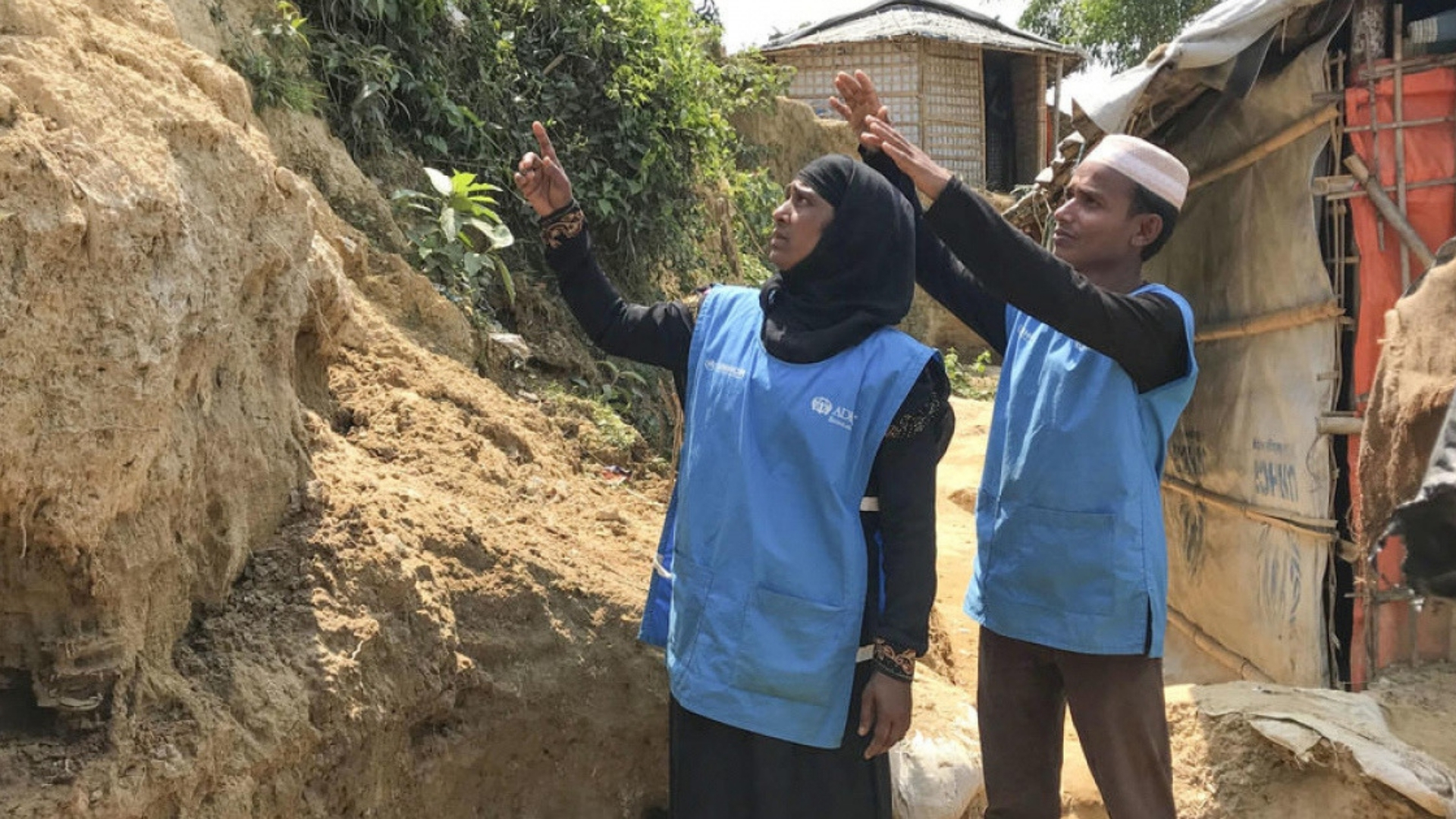 Rohingya refugee volunteers work to avert monsoon damage