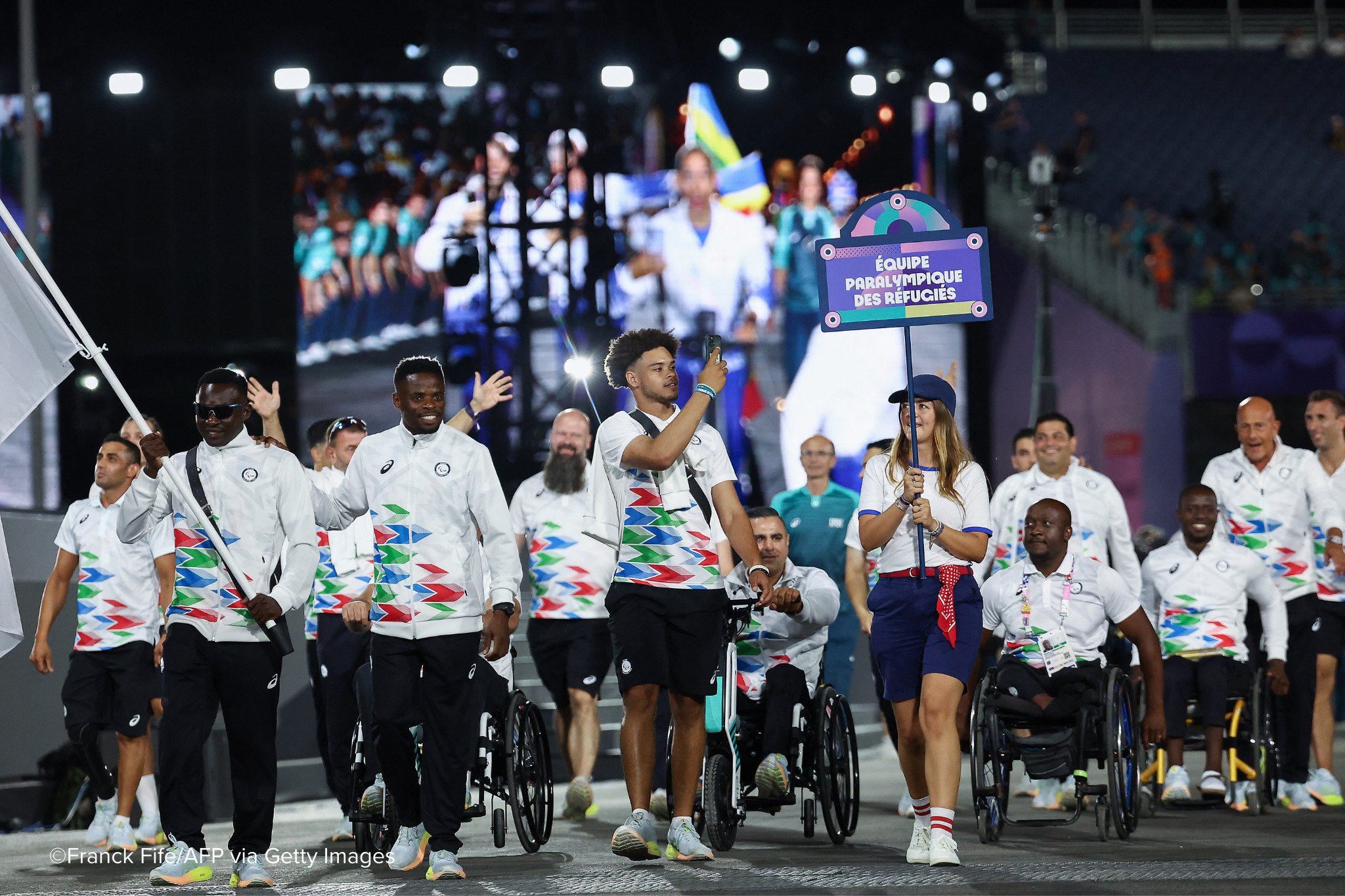 Refugee Paralympic Team takes centre stage at Paris 2024 Opening ...